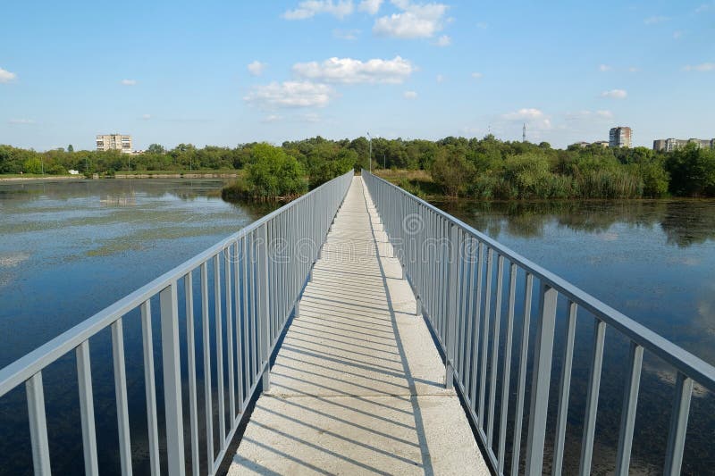 Foot bridge over the lake stock image. Image of architecture - 270856507