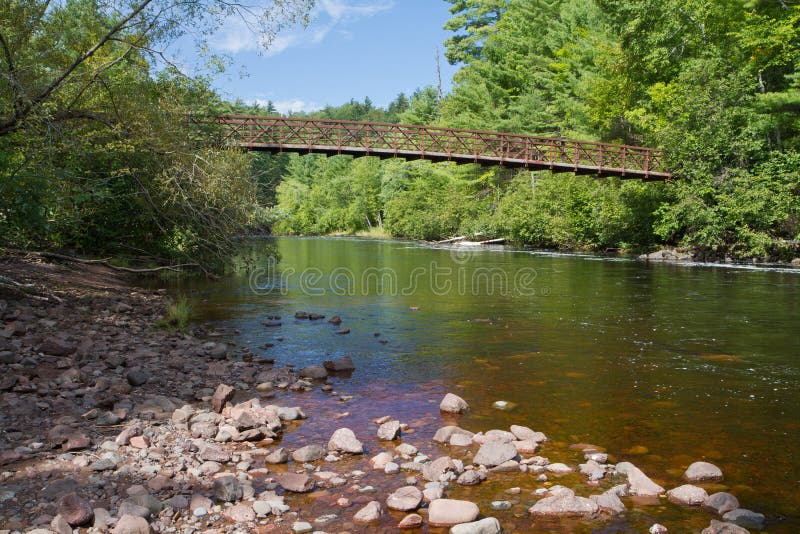 Foot Bridge over River stock photo. Image of stream, northwoods - 45269878