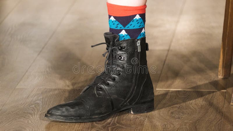 Foot in a Clown Boot with a Long Toe and a Multi-colored Sock Stock ...