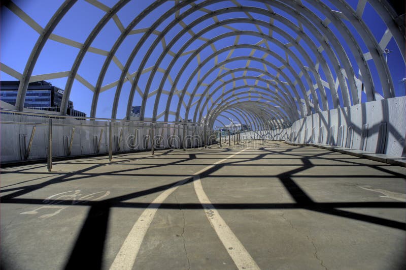 Foot and Cycle Bridge in Bright Sun Editorial Photo - Image of corridor ...