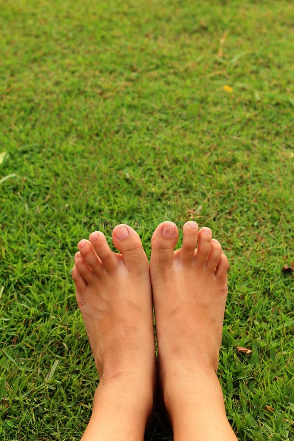 Foot on the Green Grass in the Lawn. Stock Photo - Image of barefoot ...