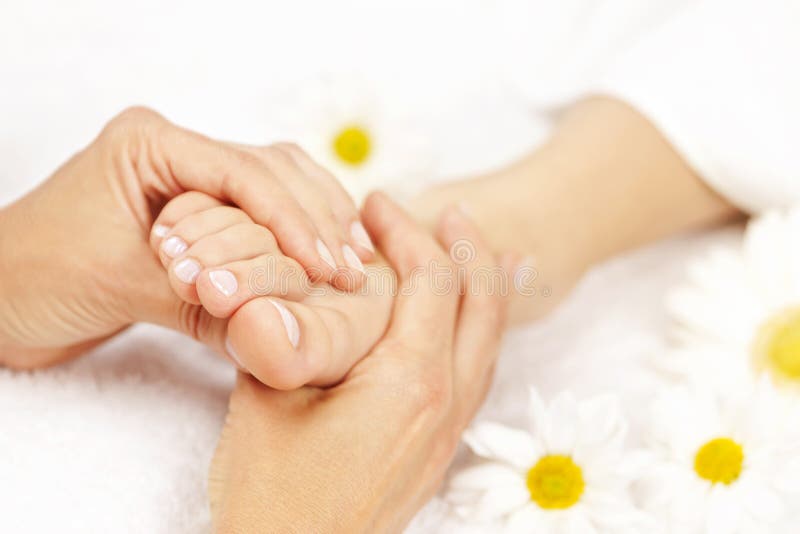 Foot Massage in the Spa Salon Stock Photo - Image of medicine, garden ...