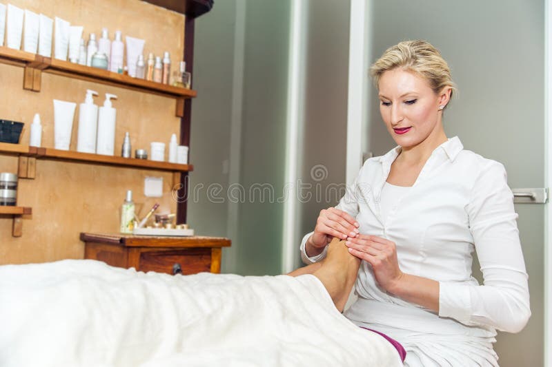 Foot Massage in a Spa Salon Stock Image - Image of blonde, therapist ...