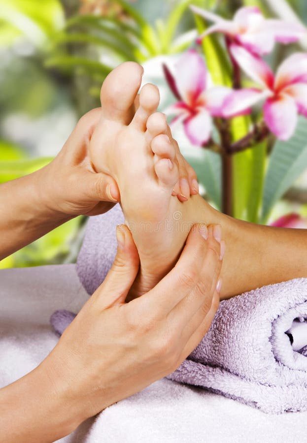 Foot Massage in the Spa Salon Stock Photo - Image of medicine, garden ...