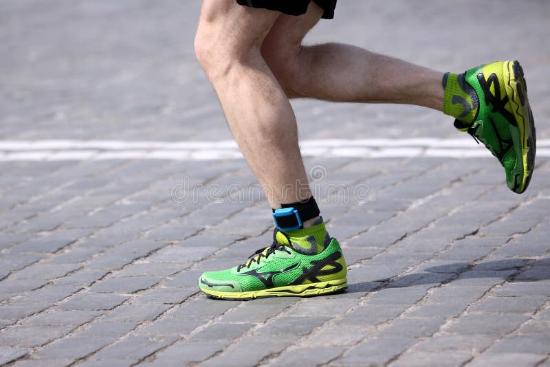 Foot Running Distance Athlete on the Stone Pavement Stock Image - Image ...