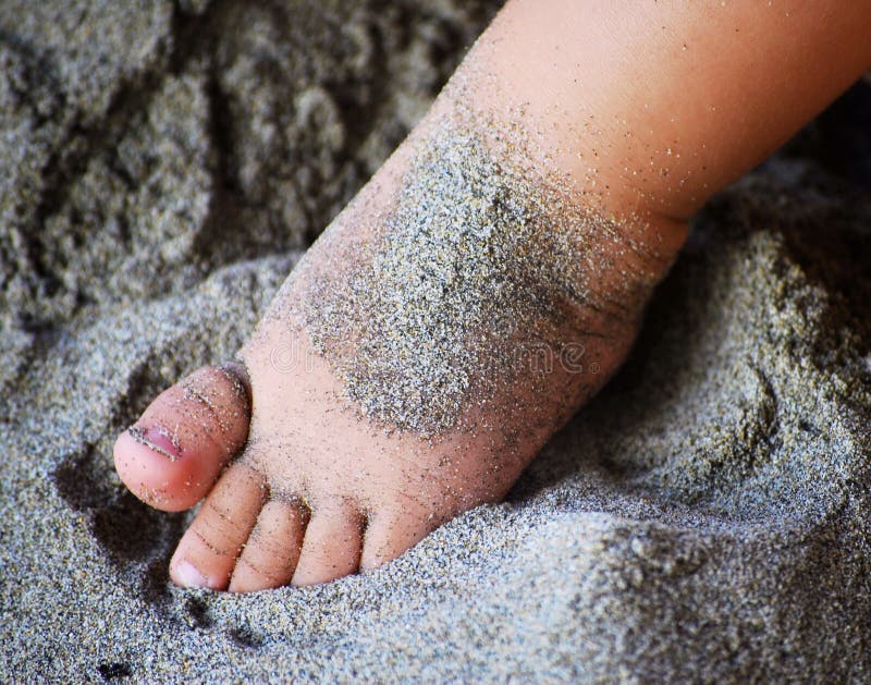 Foot in the sand stock image. Image of looking, foot - 118507329