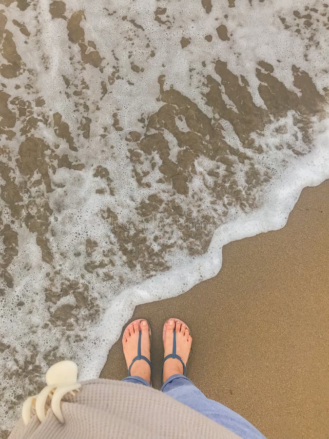 Foot, sand, and wave stock image. Image of foot, sand - 265542611