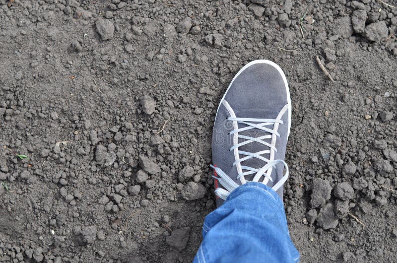 Foot on soil background stock image. Image of organic - 53095269