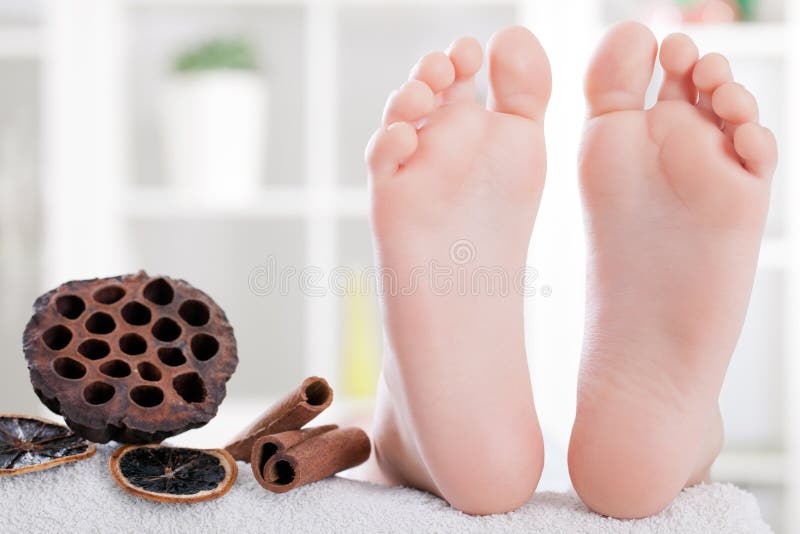 Child Foot Ready To Spa Treatment with Massage Stones Stock Photo ...