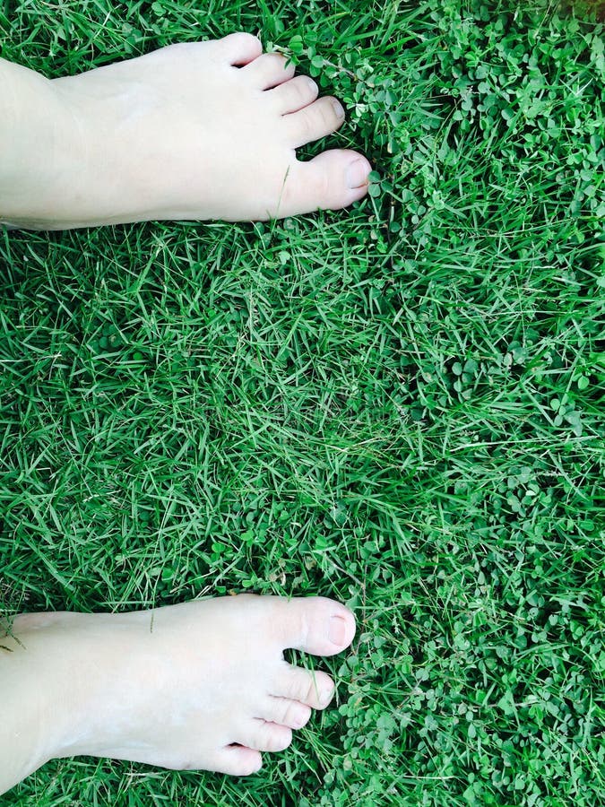 Foot stand on green stock image. Image of nail, barefoot - 61963473