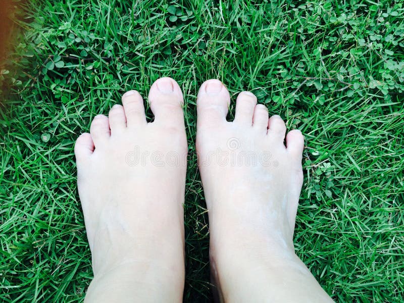 Foot stand on green stock image. Image of nail, barefoot - 61963473