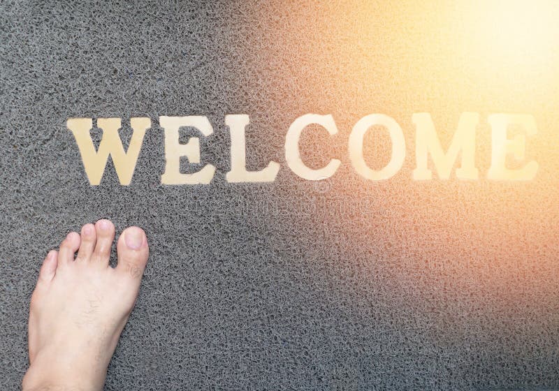Foot Stand on Grey Welcome Mat on Floor Stock Image - Image of door ...