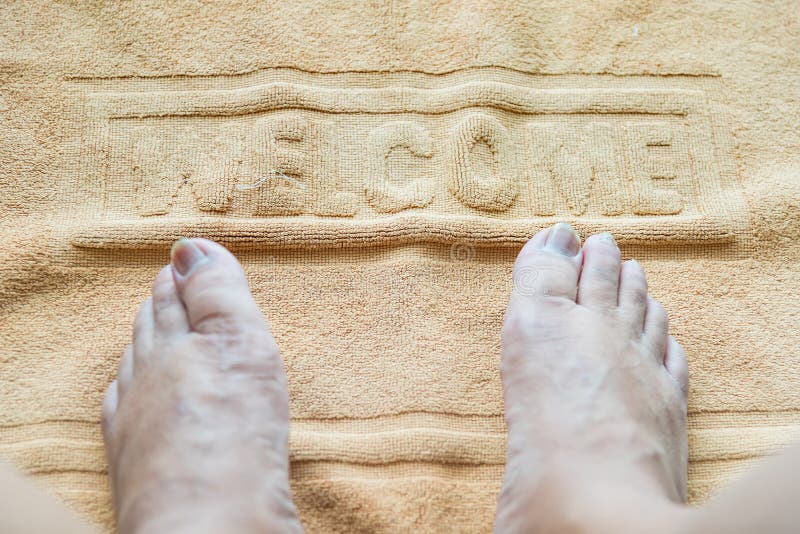 Foot Towel with Welcome Sign on the Bathroom Floor Stock Photo - Image ...