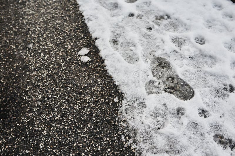Foot Tracks in Snow on Street Stock Photo - Image of sole, foot: 207815414