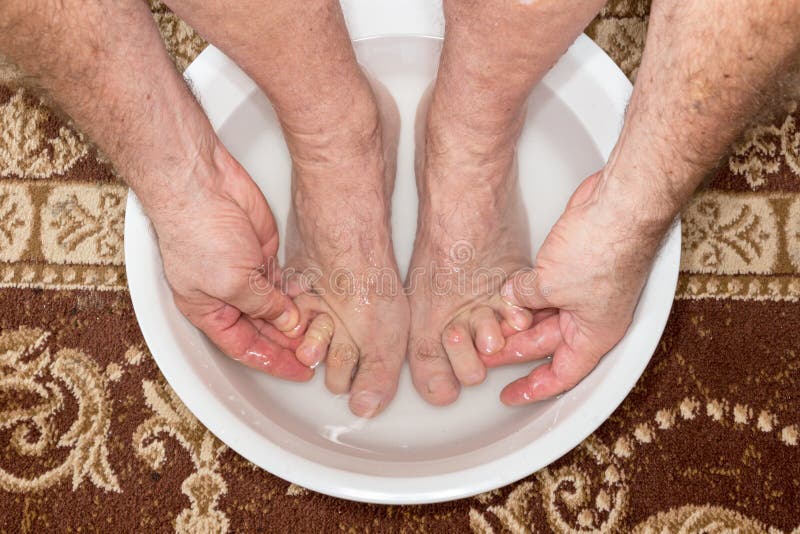 Foot washing in washbasin stock image. Image of bent - 177557287