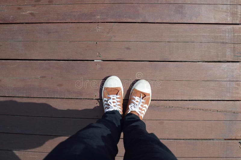 Foot on wood floor stock photo. Image of shoes, floor - 97068682