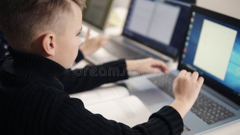 Footage of Two Little Boys Trying To Learn Programming. Educational ...