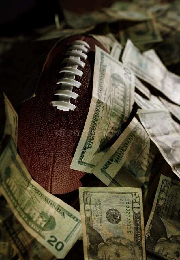 A Football Covered in a Pile of Money Stock Photo - Image of payment ...