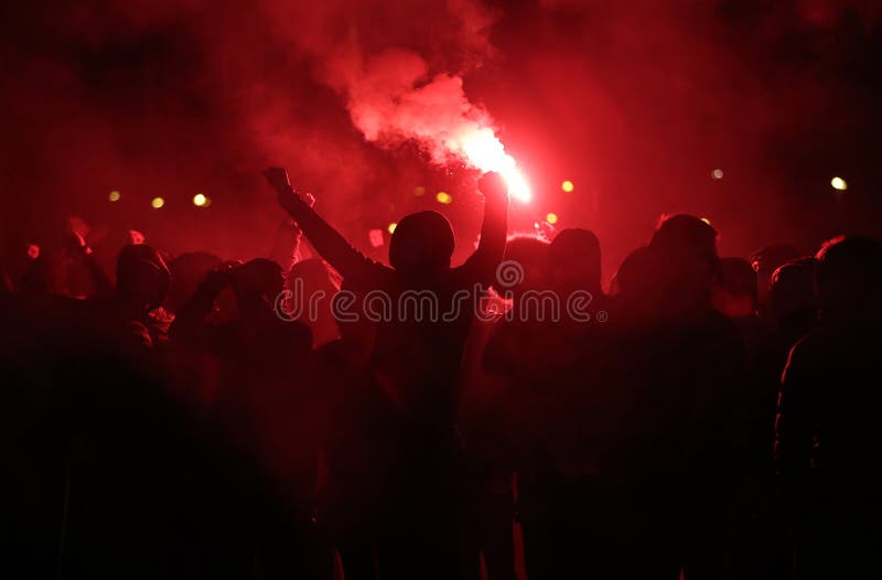 Football fans with torches stock image. Image of silhouette - 221237807