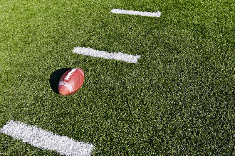 Football on field stock photo. Image of light, ball, field - 76313250
