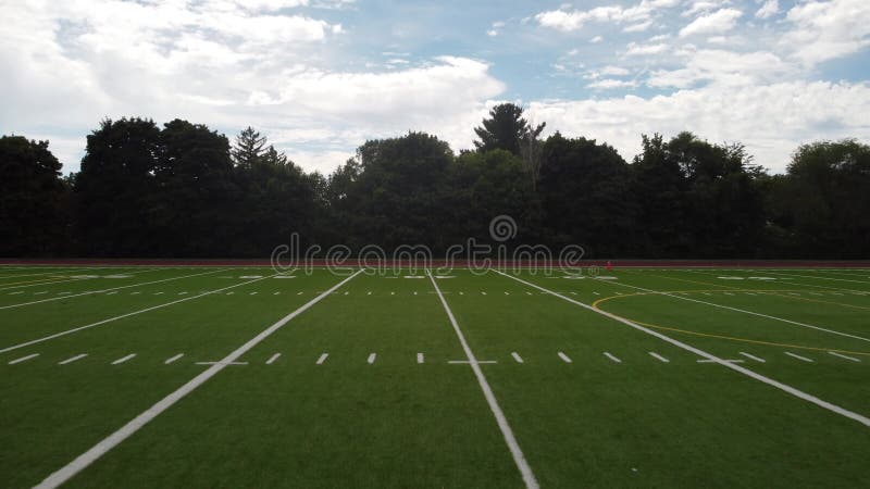 Football Field that is Lit Up in the Night. Flying Over Illuminated ...
