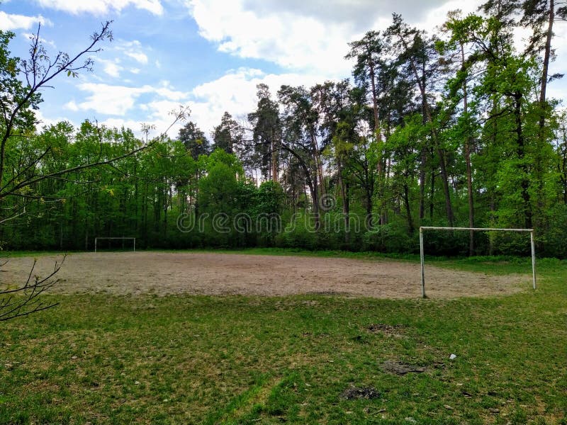 Football Field in Green Spring Forest Stock Photo - Image of clouds ...