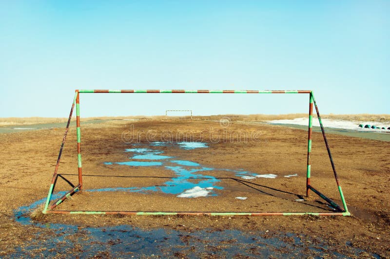 Football field in spring stock photo. Image of mood, snow - 50545072