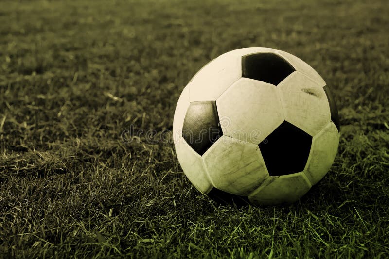 Football on Field with Vintage Style Processed Stock Image - Image of ...
