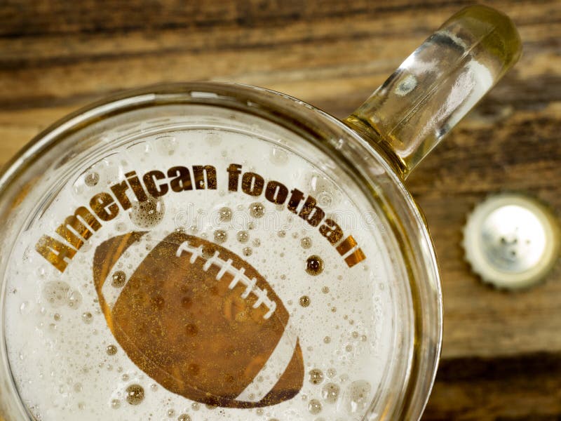 Football in a fresh beer stock photo. Image of equipment - 83493946
