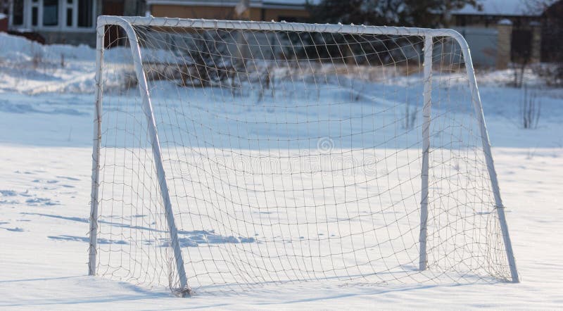 Football goal in the snow stock photo. Image of closeup - 235228510