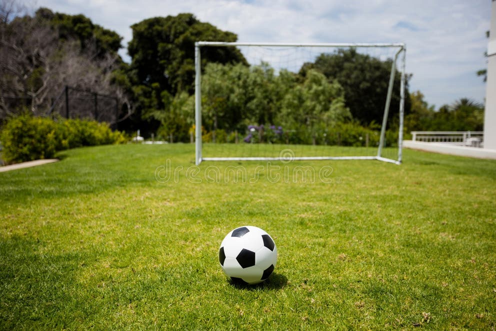 Football on grass field stock image. Image of green, post - 84097733