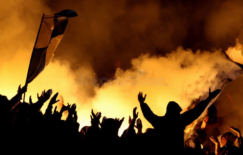 Football Hooligans With Mask Holding Torches In Fire Stock Photo ...
