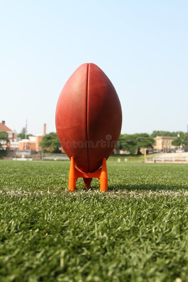 Football on a kicking tee stock image. Image of leather - 28907409