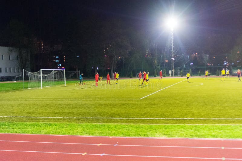 Football match at night stock image. Image of backgrounds - 125561385