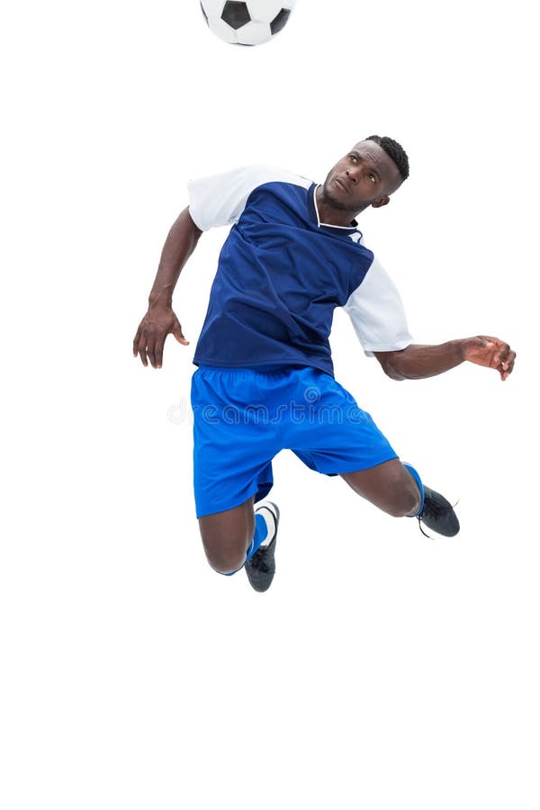 Football Player in Blue Heading Ball Stock Image - Image of football ...
