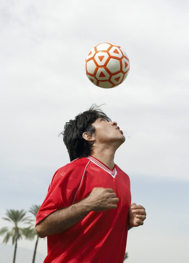 Football Player Heading the Ball Stock Image - Image of latin, talent ...