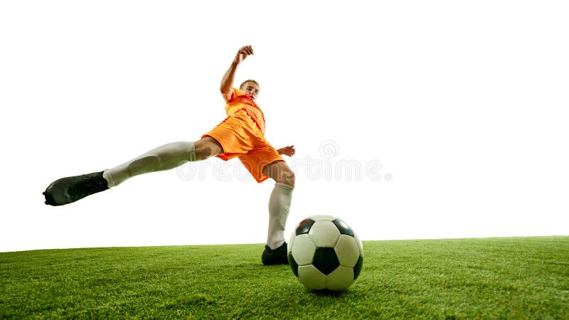 Football Player Performs Powerful Kick Towards Ball, Displaying Dynamic ...