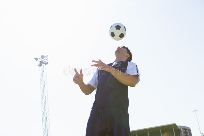 Football Player Practicing Soccer Stock Image - Image of warm, athlete ...