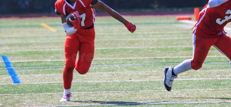 Football Player Running Down the Field after Catching a Pass Stock ...