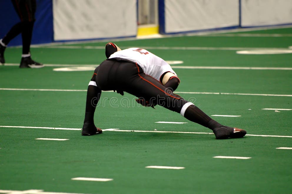 Football player stretch stock image. Image of football - 1048307