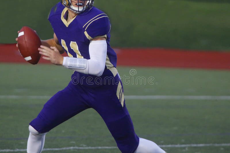 Football Quarterback Looking Downfield Stock Photo - Image of ...