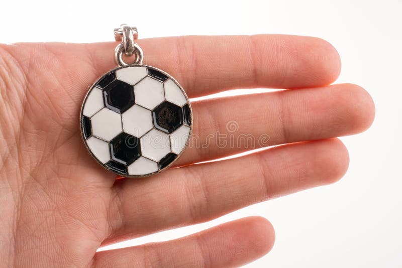 Football Shaped Keyholder in Hand Stock Image - Image of keyholder ...