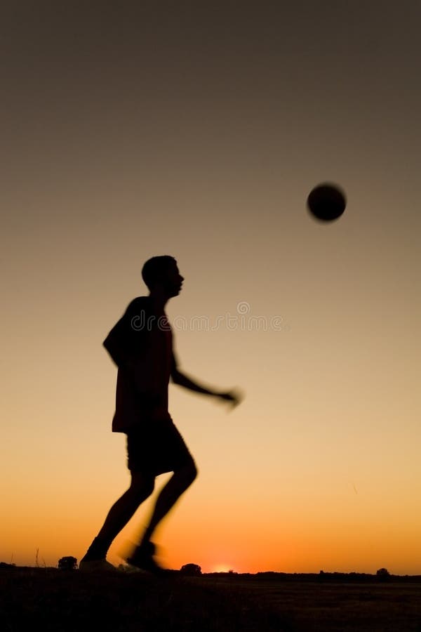 Football at sunset stock image. Image of athletic, silhouette - 2790265