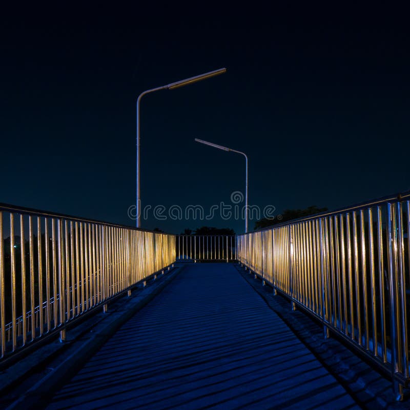 Footbridge with Light Reflection at Night Stock Photo - Image of light ...