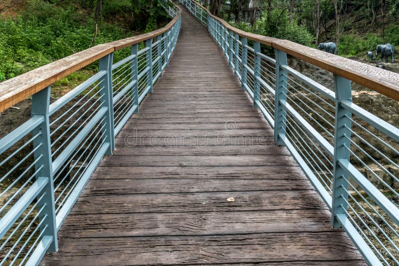 Footbridge in the park stock image. Image of adventure - 78272421