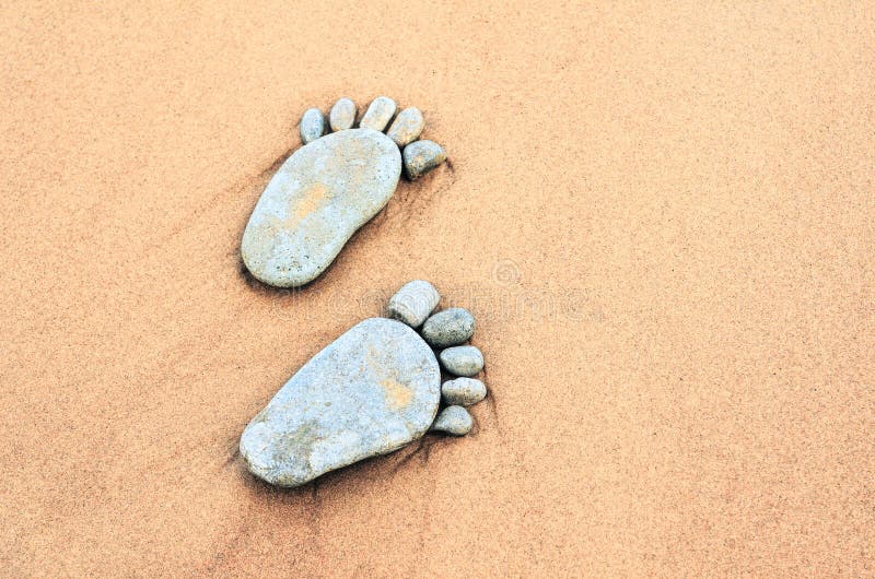 Stone footprints stock image. Image of green, coast, barefoot - 34783235