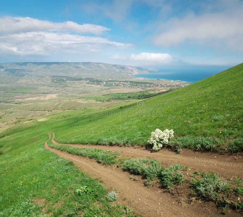 Footpath and green hill stock photo. Image of horizon - 124328440