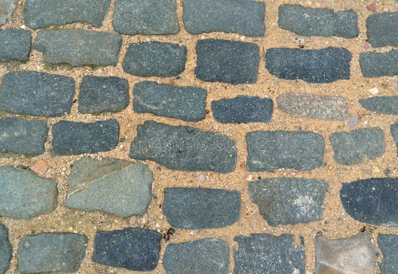 The Footpath is Paved with Natural Stone and Sand. Stone Pavement Stock ...