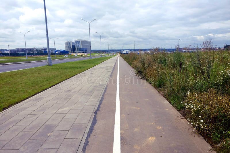 Footpath of Paving Slabs and a Strip for Bicycle Stock Photo - Image of ...