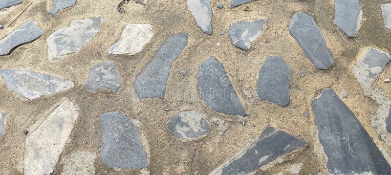 The Footpath Surface is Paved with Cement and Marble Tiles with a Dark ...
